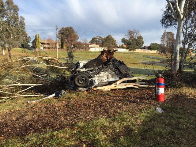 Man dies after car ploughs into tree, catches fire in Canberra's north ...