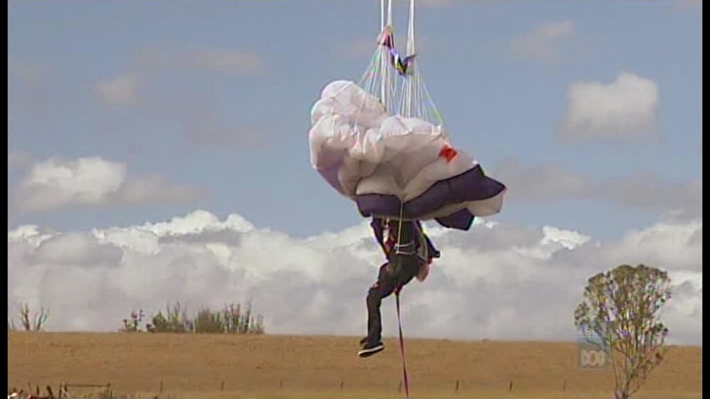 Woman left hanging after parachute mishap - ABC News