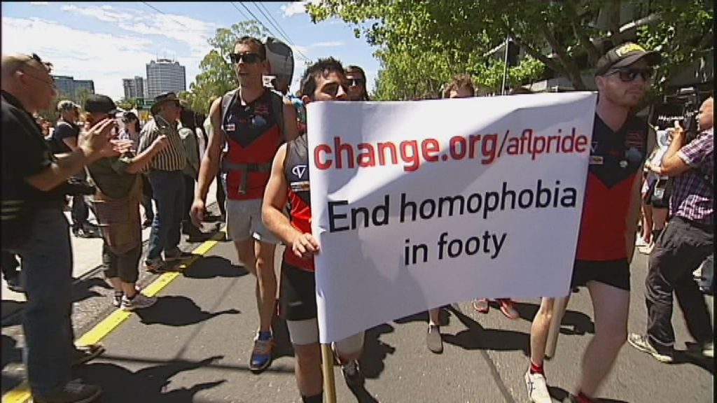 AFL footballers march at gay pride event - ABC News