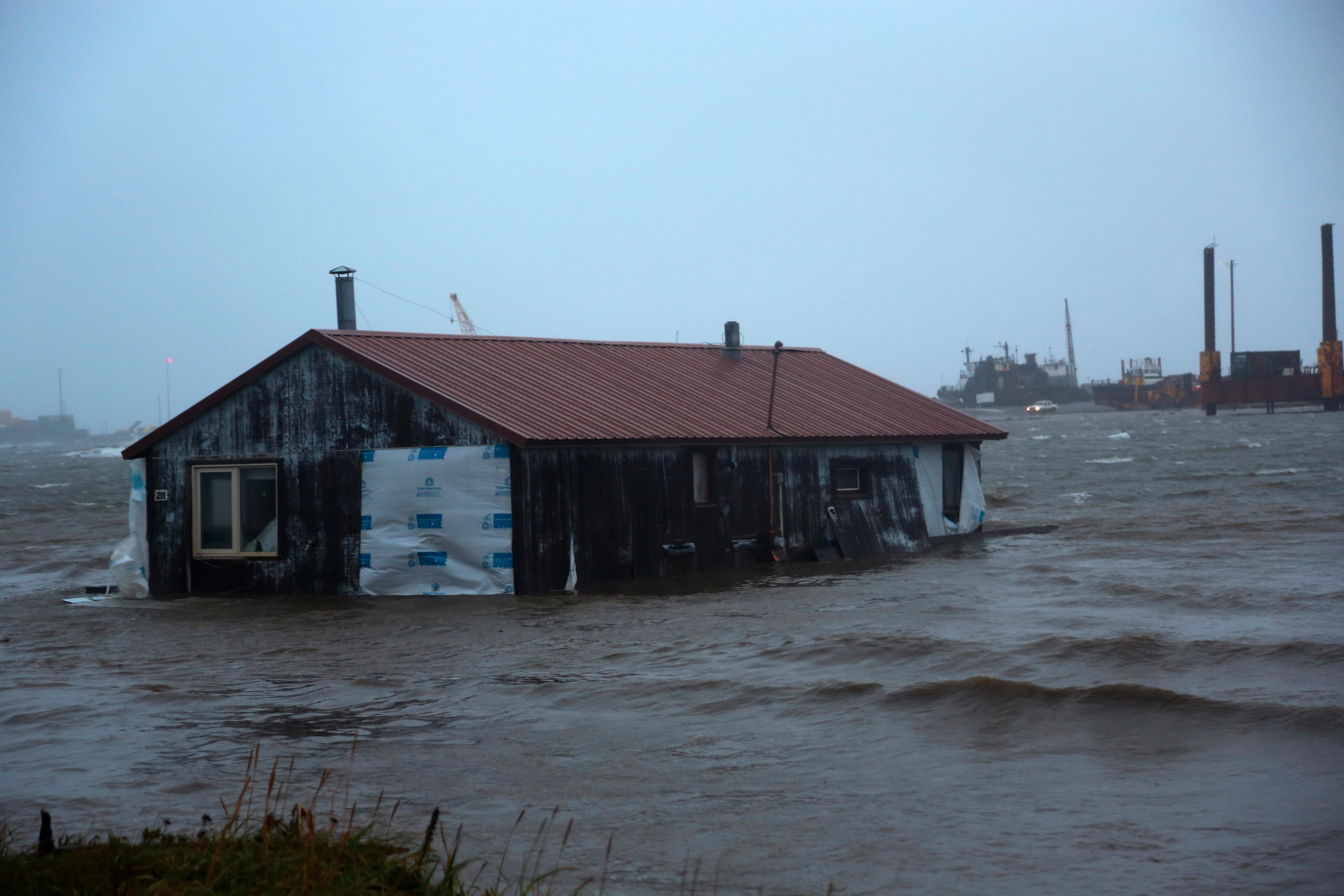 Storm battering western Alaska causes widespread flooding, homes moved ...