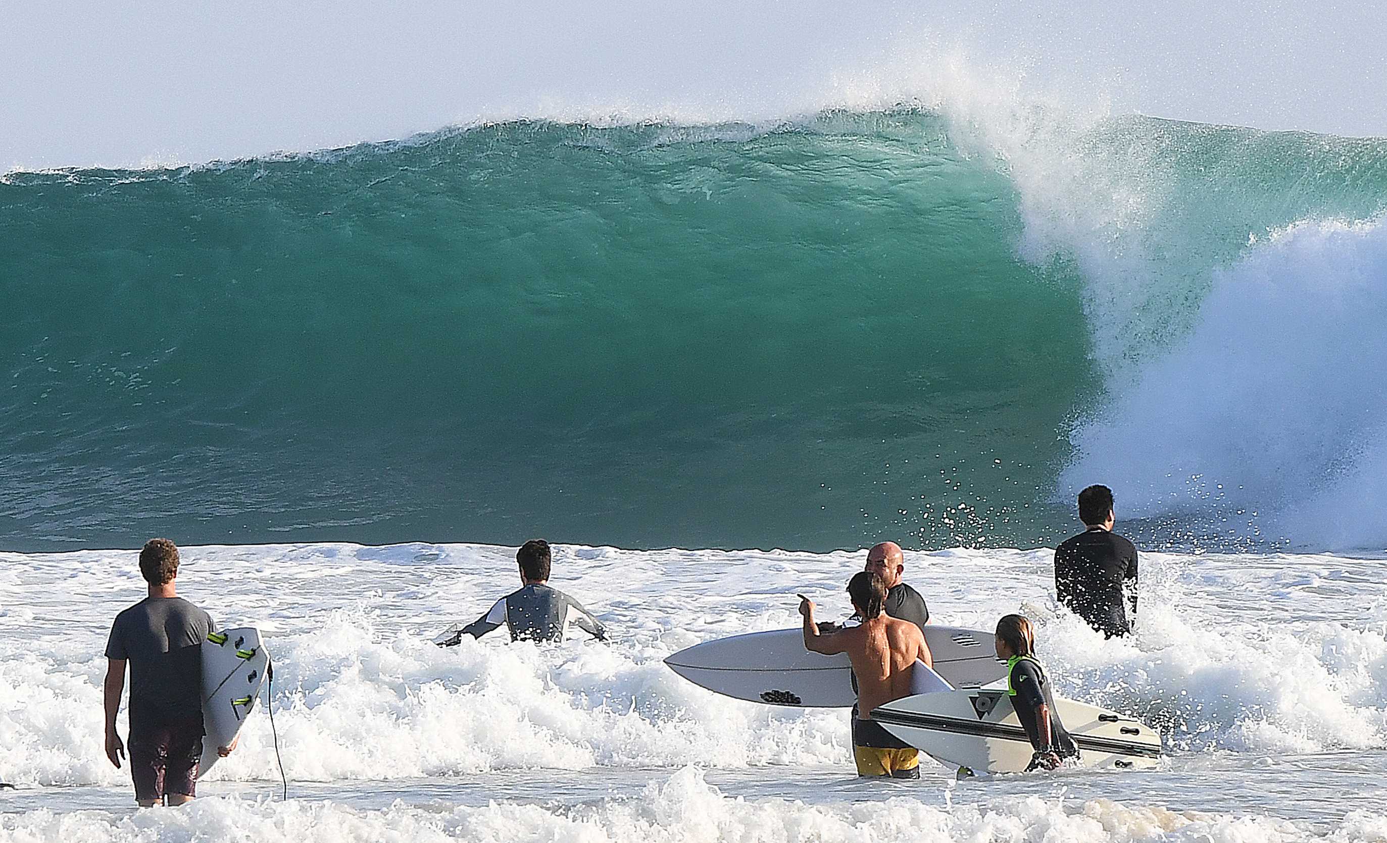 Dozens rescued as dangerous swell slams south-east Queensland - ABC News