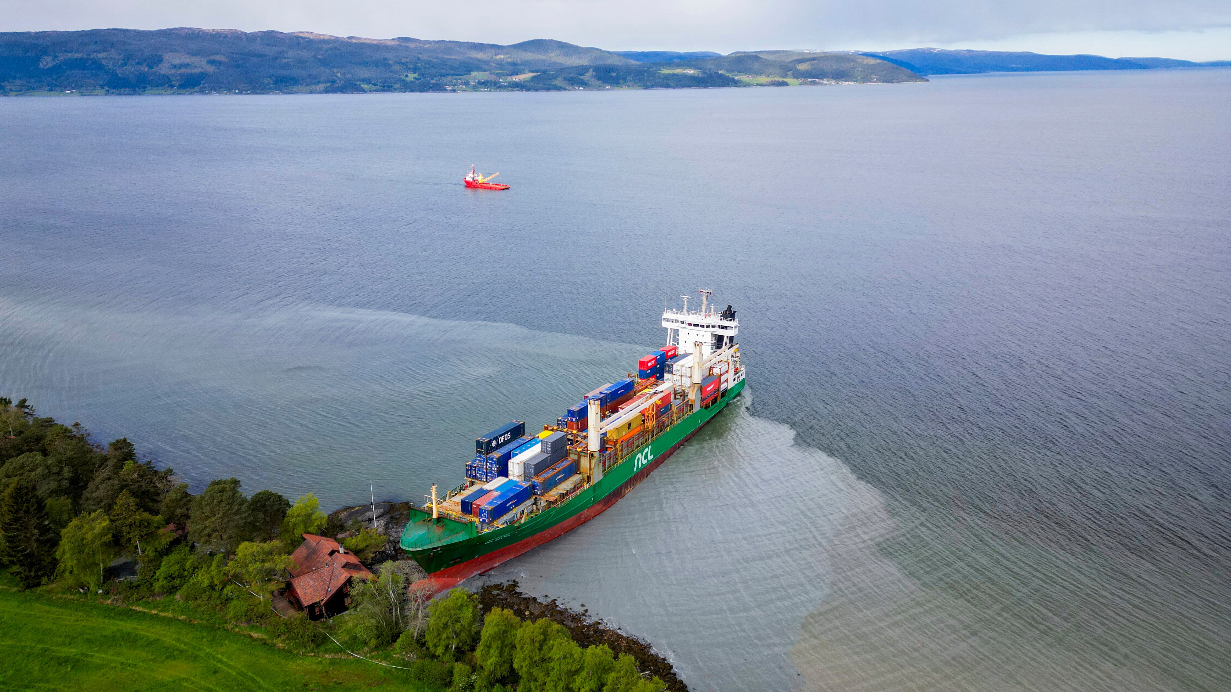 'Bulky new neighbour': Norwegian man wakes to find cargo ship in his ...