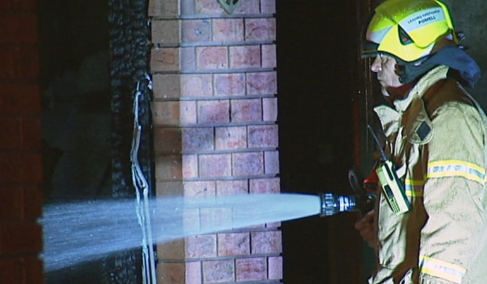 Neighbours help family climb over back fence to escape house fire in ...