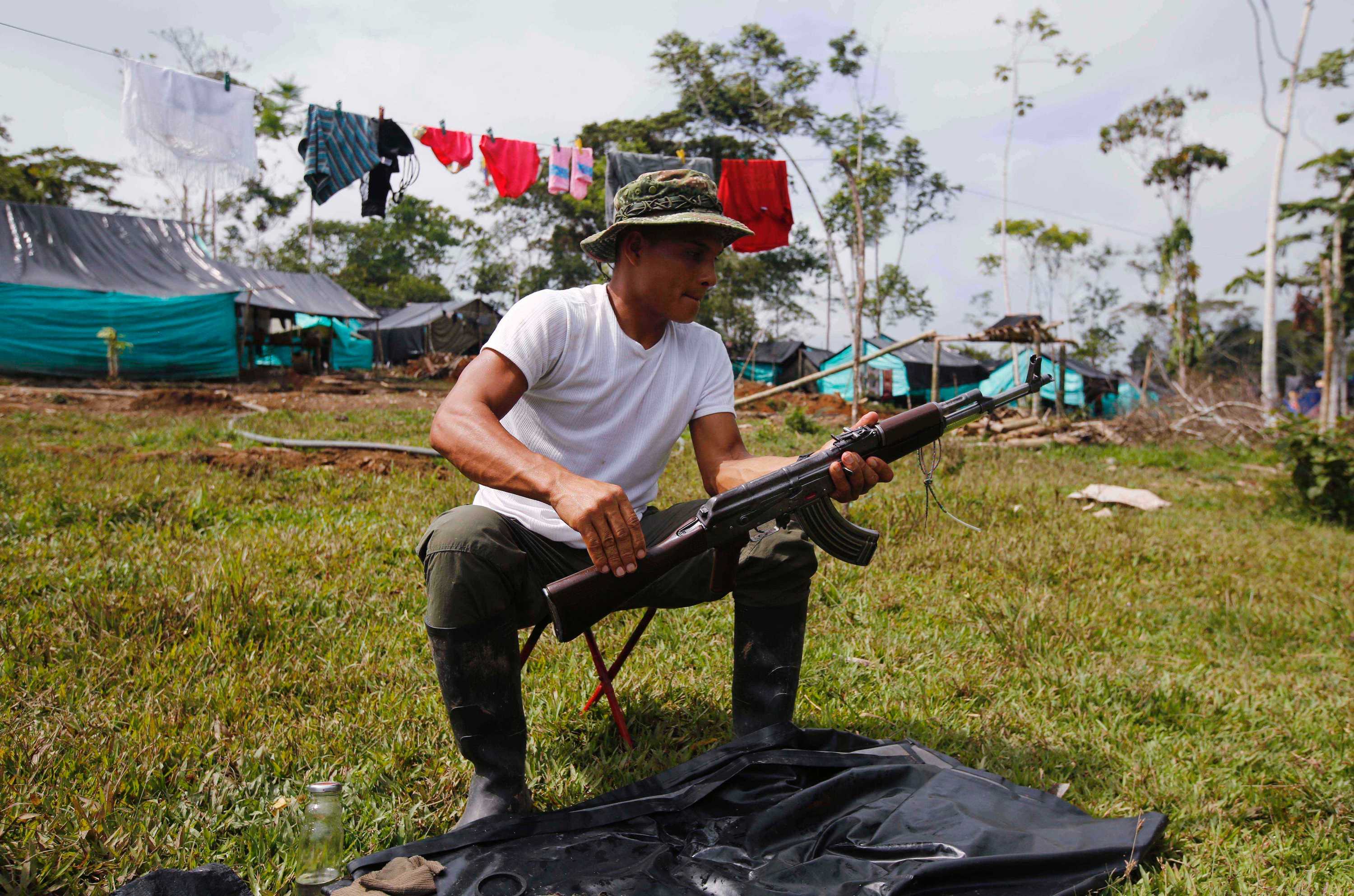 Colombia's FARC rebels begin surrendering weapons under peace deal ...