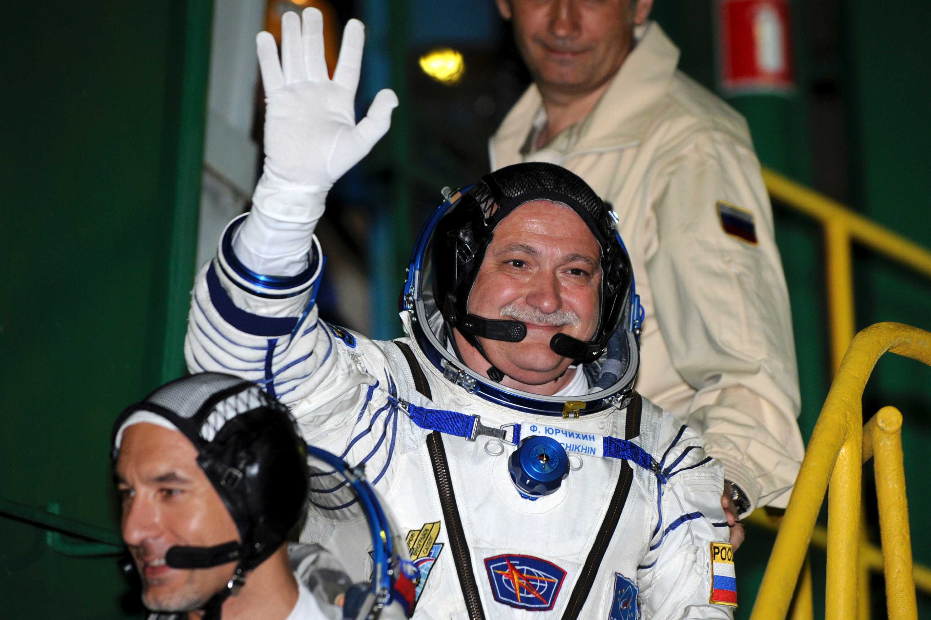 Russian rocket carries three international astronauts on short cut to ...