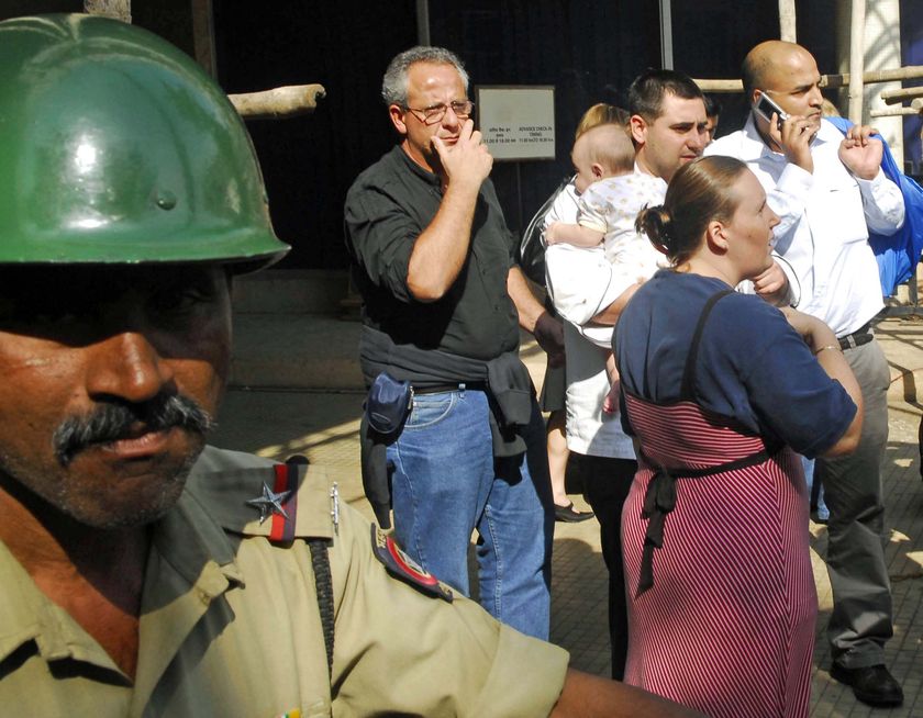 Heavy fire at Taj hotel as hostage stand-off continues - ABC News