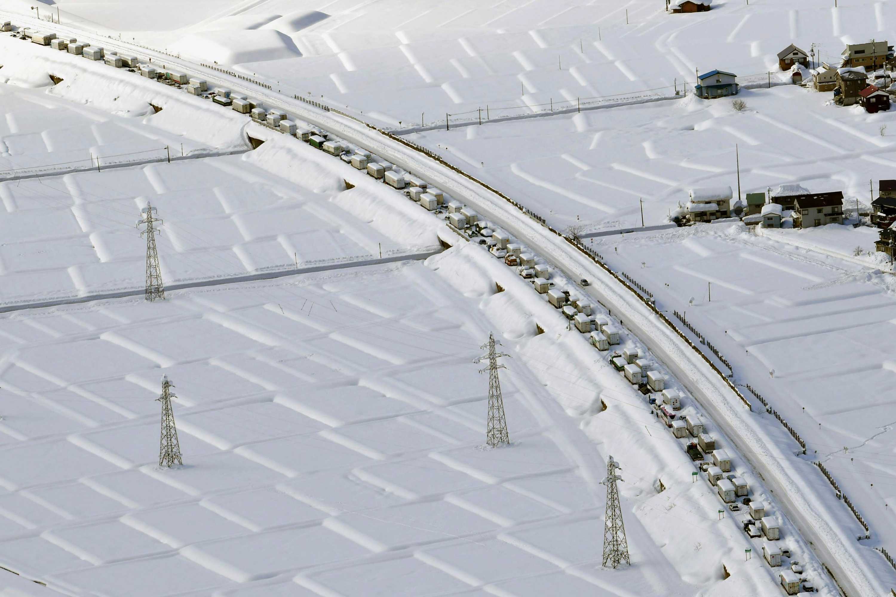 Japanese snowstorm brings traffic to a halt on expressway in Niigata ...