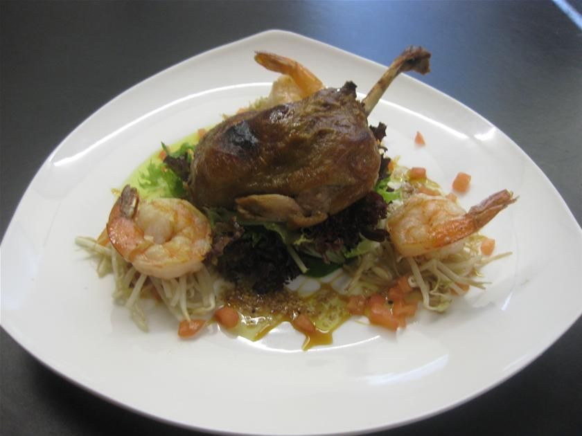 Salad of duck confit with tiger prawns, pickled bean sprouts and a ...