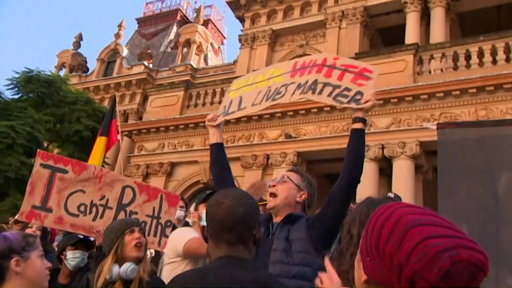 A counter-protester is led away by NSW Police - ABC News