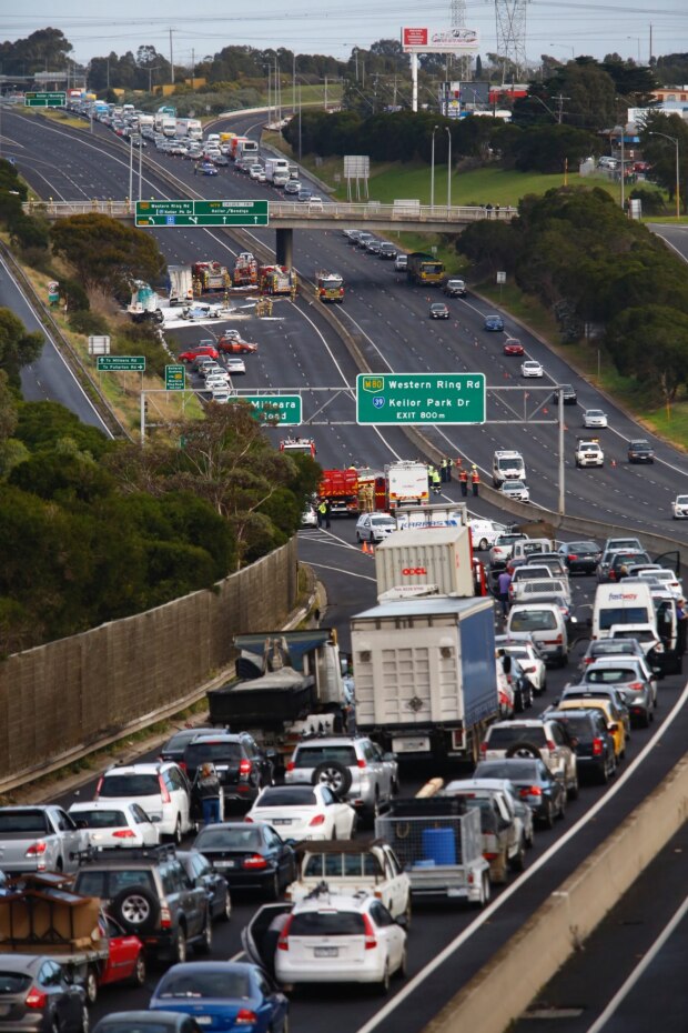 Calder Freeway crash: One dead after petrol tanker rolls, fuel spilt ...