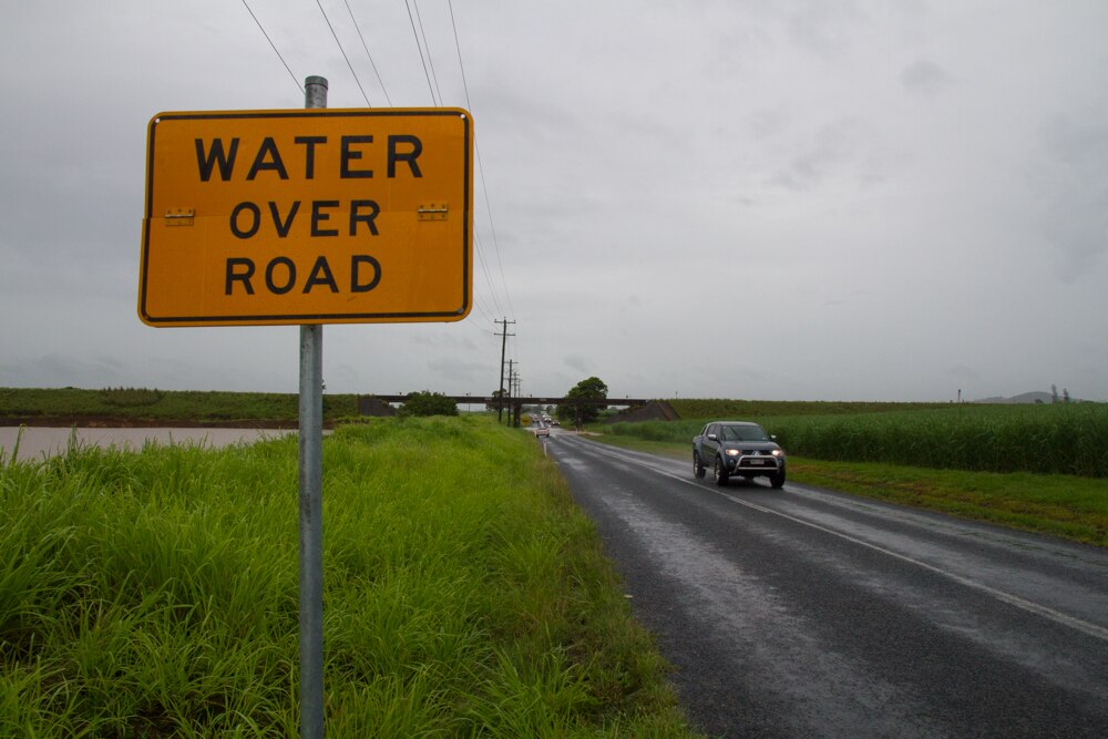 Swift water rescue crew help north Queensland drivers stuck in flood ...