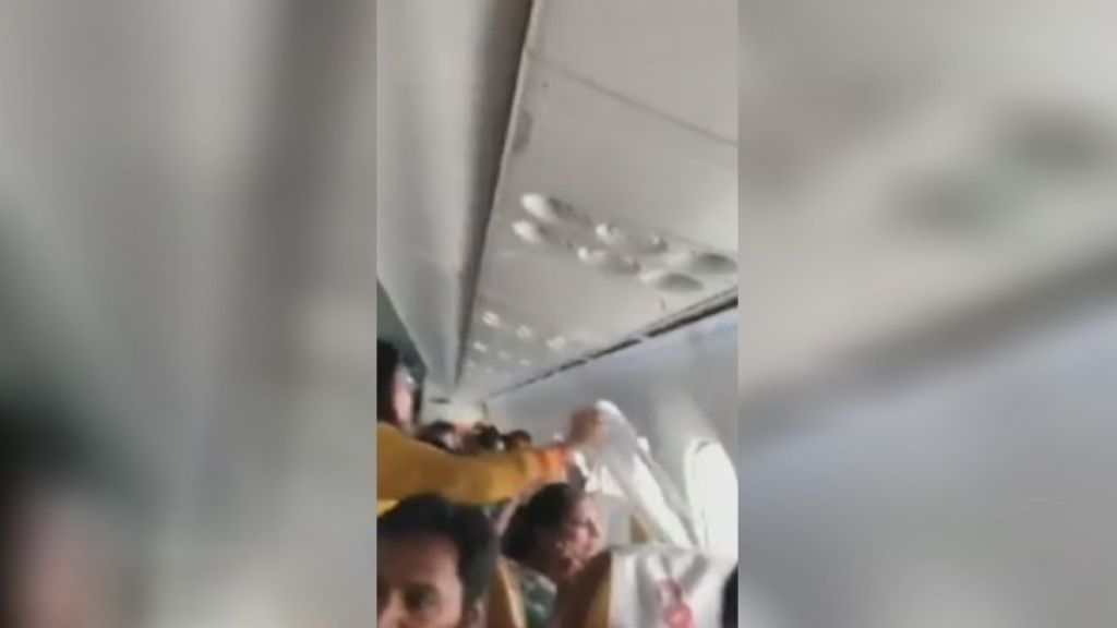 Passengers panic after part of window panel falls out during Air India ...