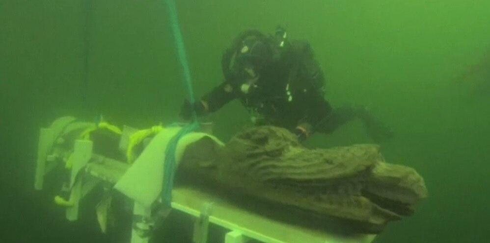 Sea monster figurehead salvaged by divers from 15th-century Danish ...