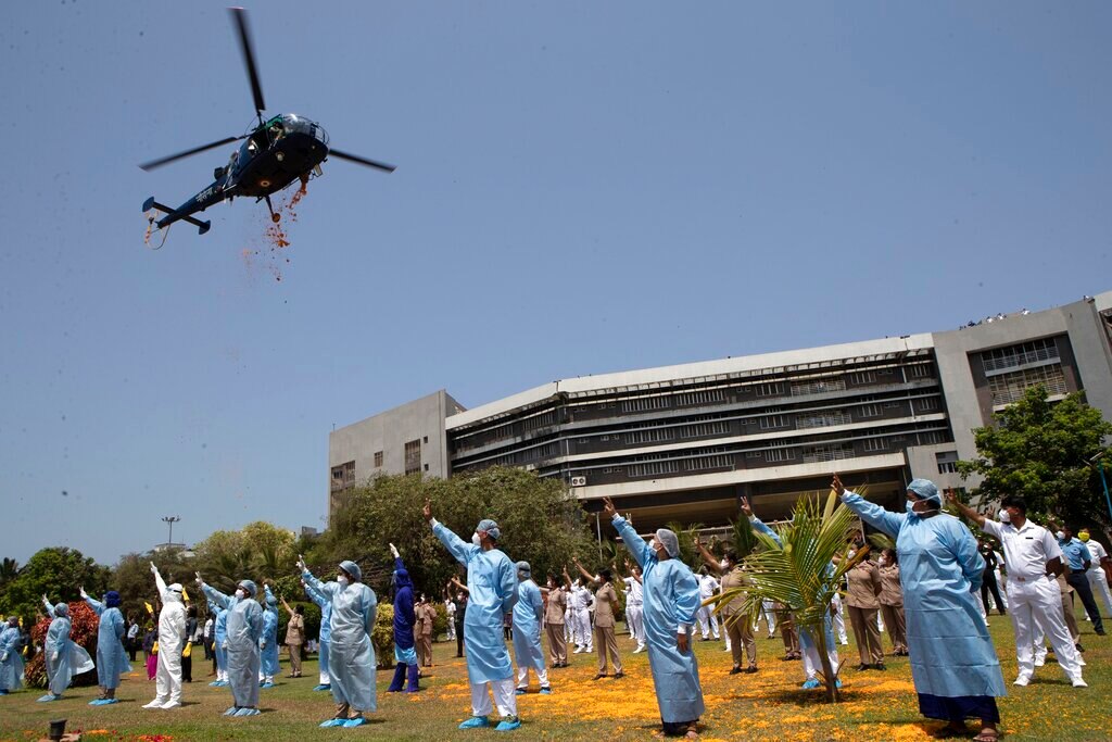 India's COVID-19 health workers showered in flower petals as military ...