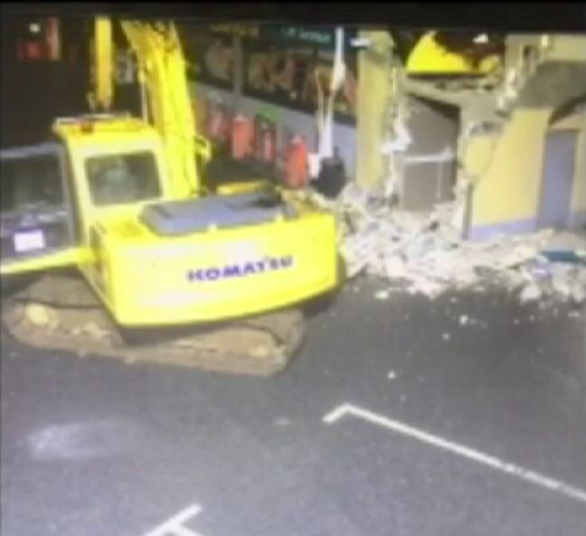Stolen excavator used to rip ATM from shop wall in Northern Ireland ...