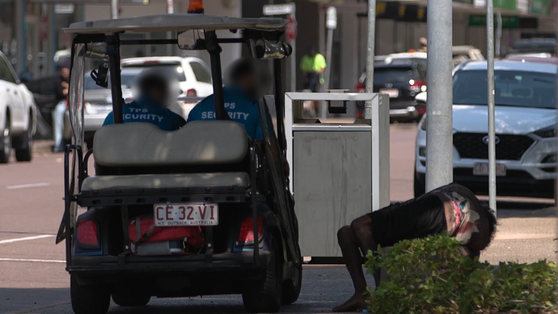 A guard prods the woman. - ABC News