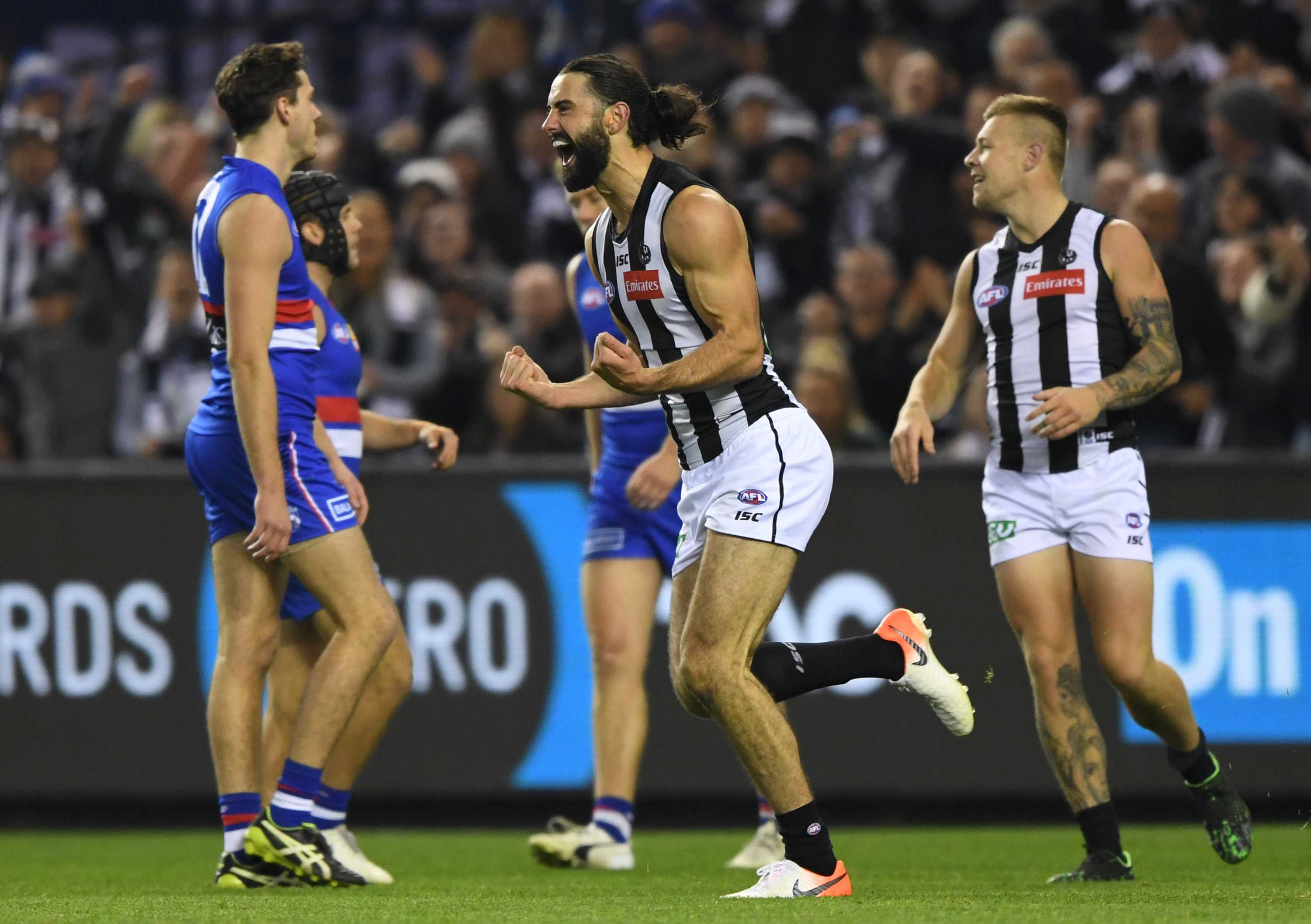 Collingwood moves up to second on the AFL ladder after tough win over ...