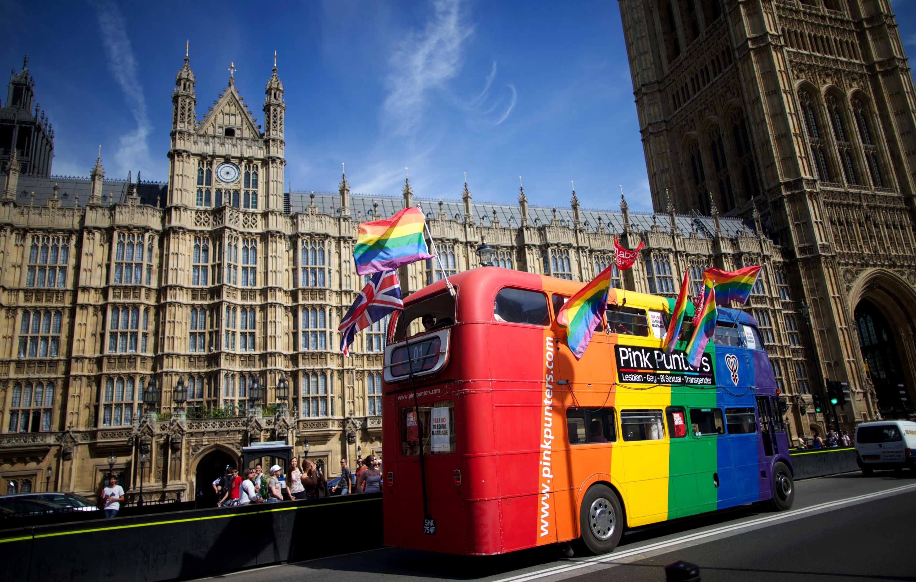 Gay rights activists cheer as British same-sex marriage bill passes ...