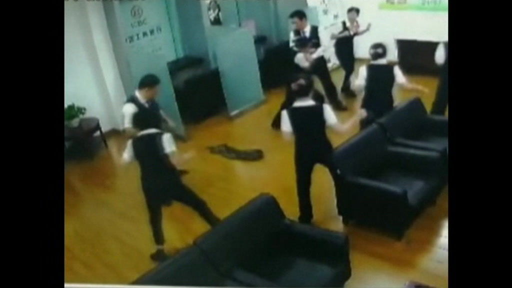 Python drops from ceiling during a staff meeting at China bank - ABC News