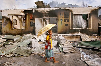 Police to comb razed Solomons buildings - ABC News