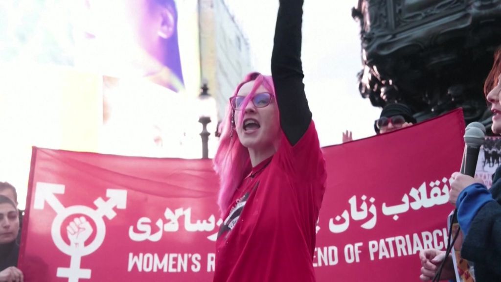Dozens of activists in London cut their hair in support of women's ...
