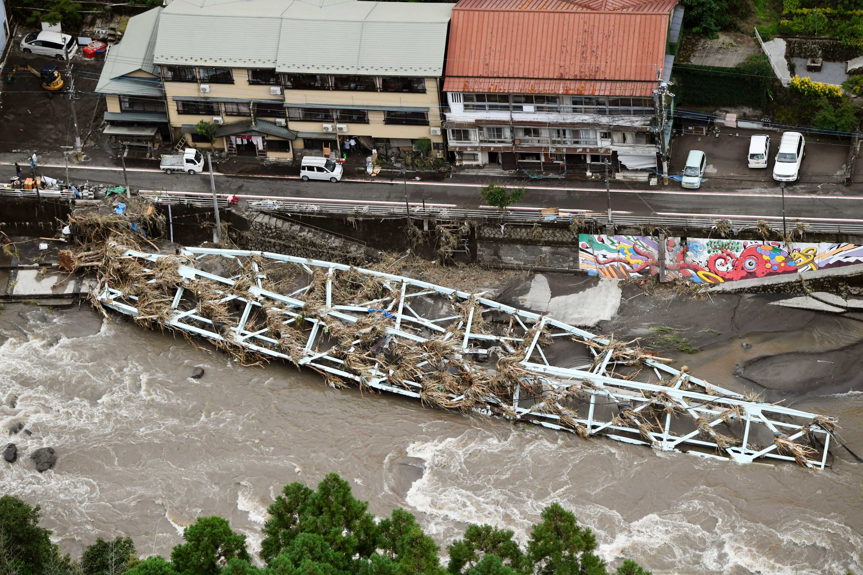 Japan battered by more heavy rain and flooding, leaving 58 dead - ABC News